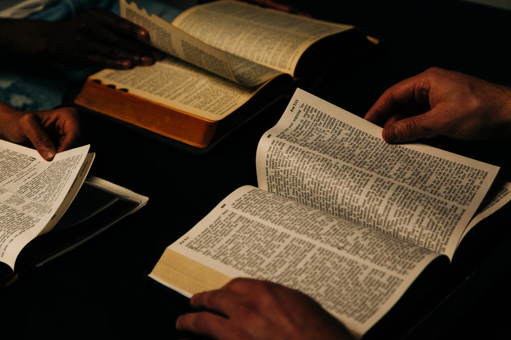 Group Reading the Bible Together - Church stock photos - Logos Sermons