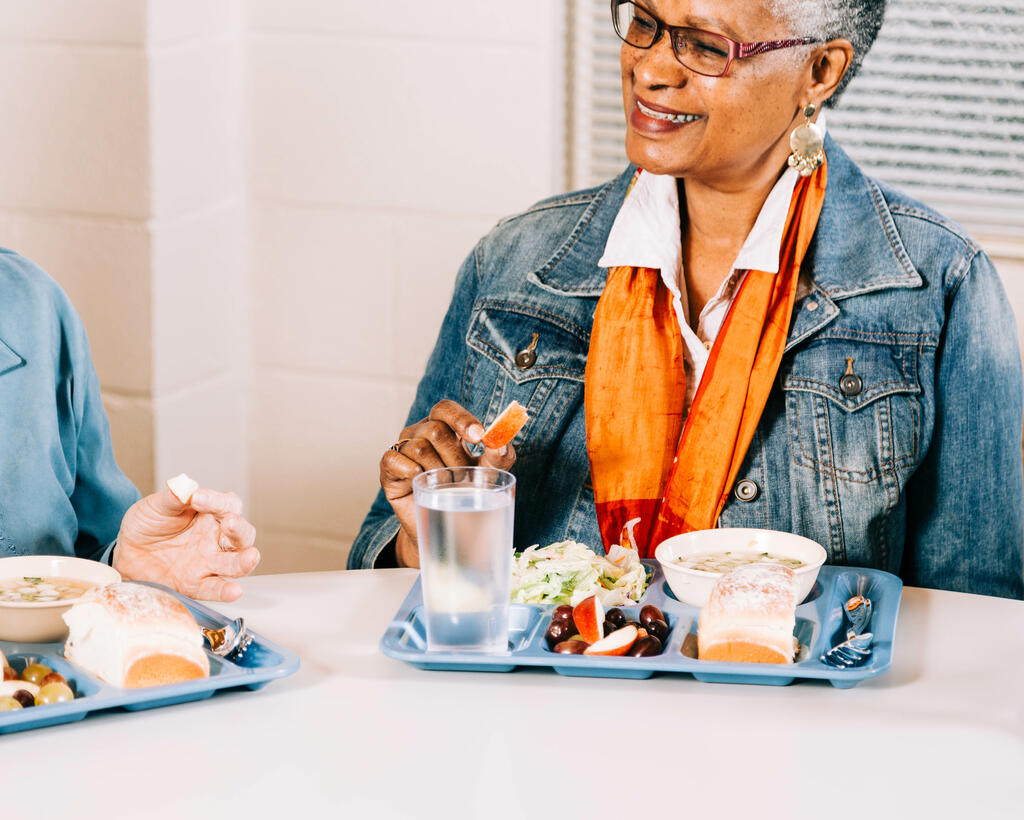 People Laughing Together During a Community Meal - Church stock photos ...